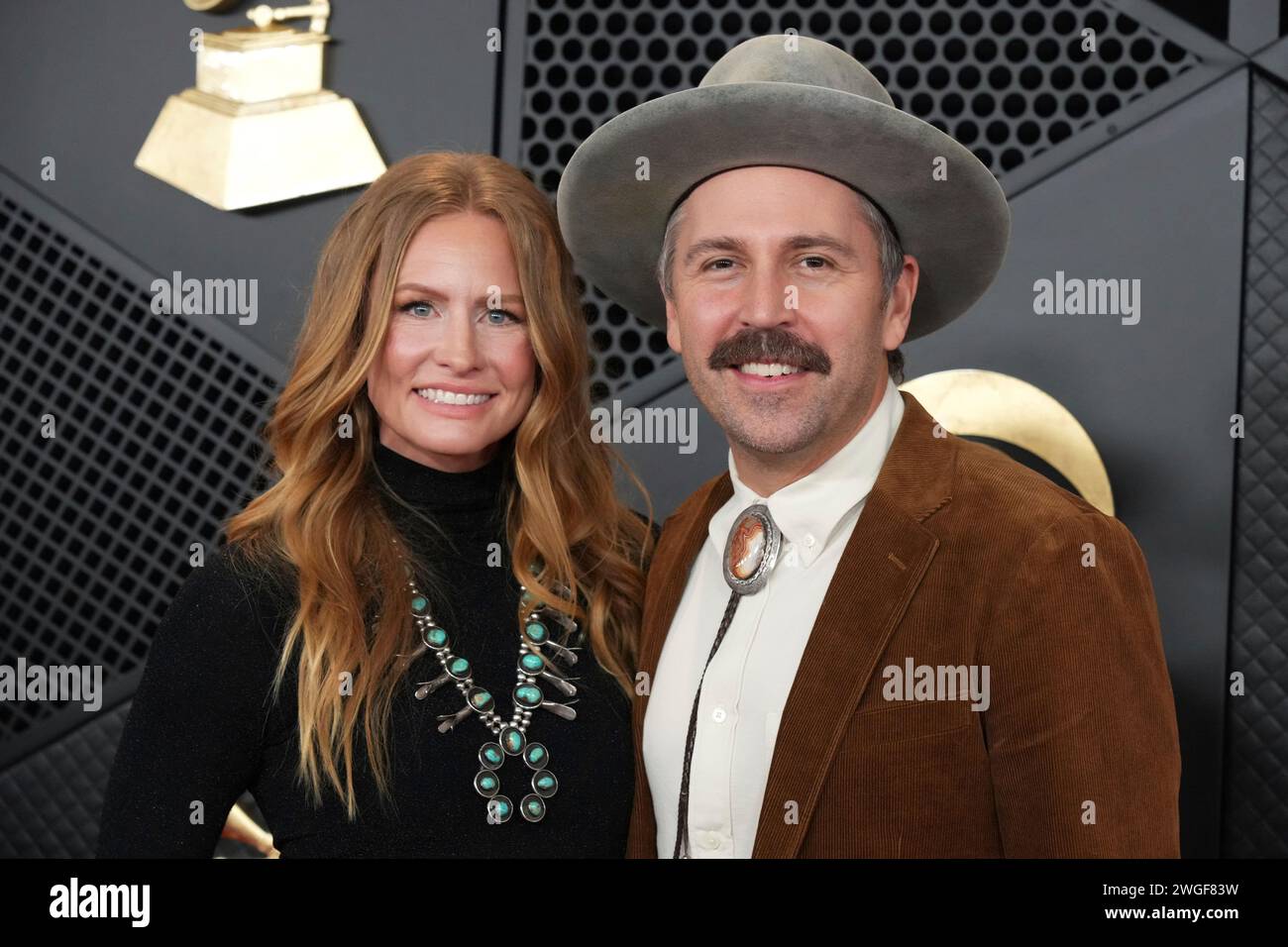 Elley Duhey, left, and Hank Bentley arrive at the 66th annual Grammy ...