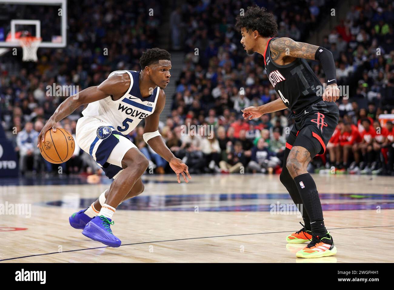 Minnesota Timberwolves guard Anthony Edwards (5) dribbles as Houston ...