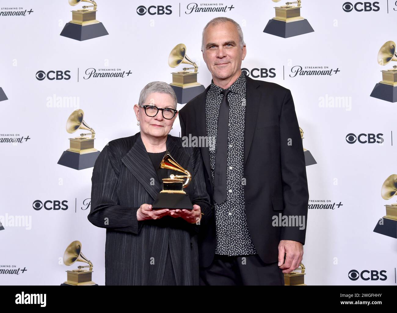 Jeri Heiden, left, and John Heiden pose in the press room with the ...