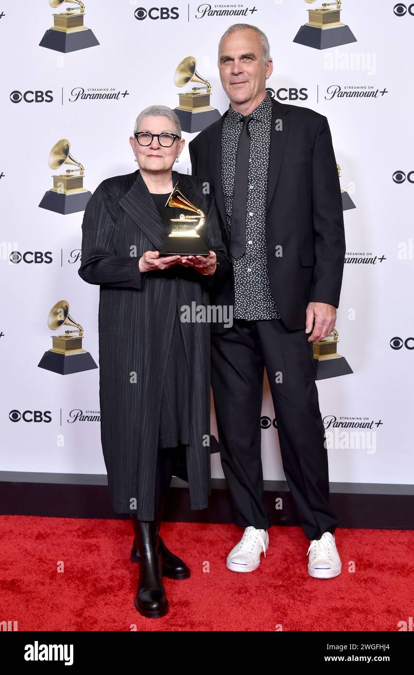 Jeri Heiden, left, and John Heiden pose in the press room with the ...