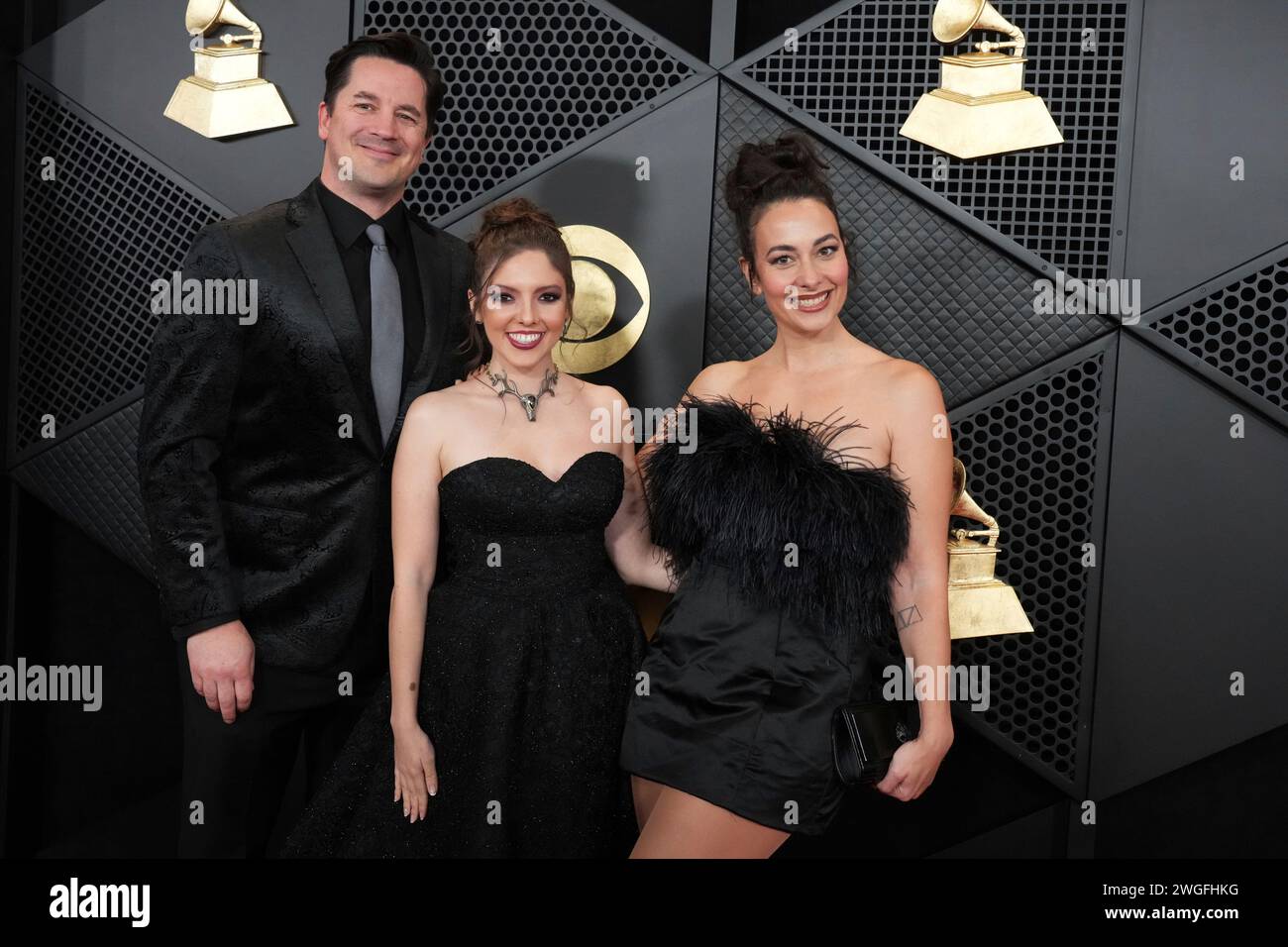 Chris Bacon, Alana Dafonseca, Erin Aydingoz arrive at the 66th annual Grammy Awards on Sunday ...