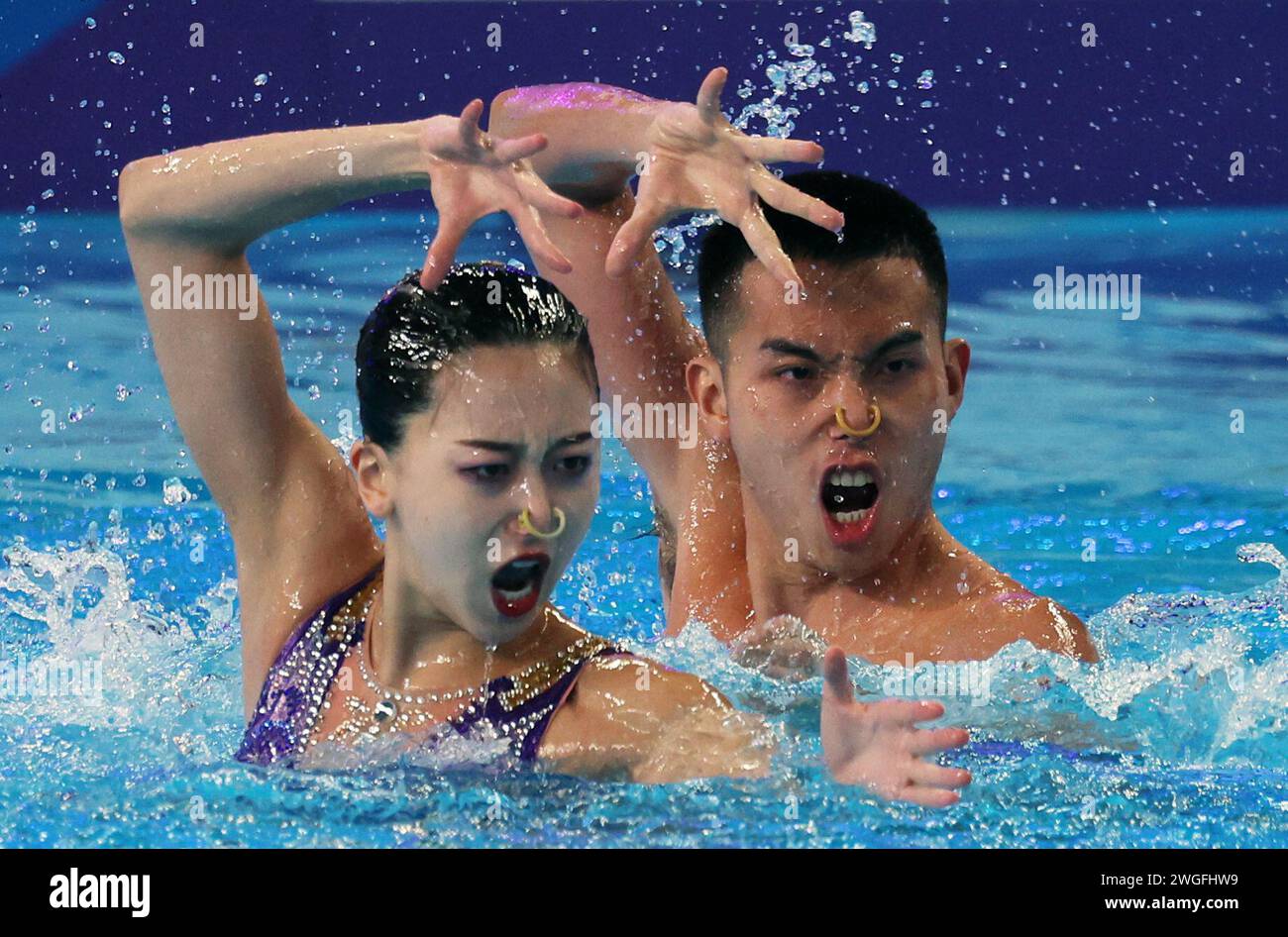 Doha, Qatar. 4th Feb, 2024. Cheng Wentao (L)/Shi Haoyu of China perform ...