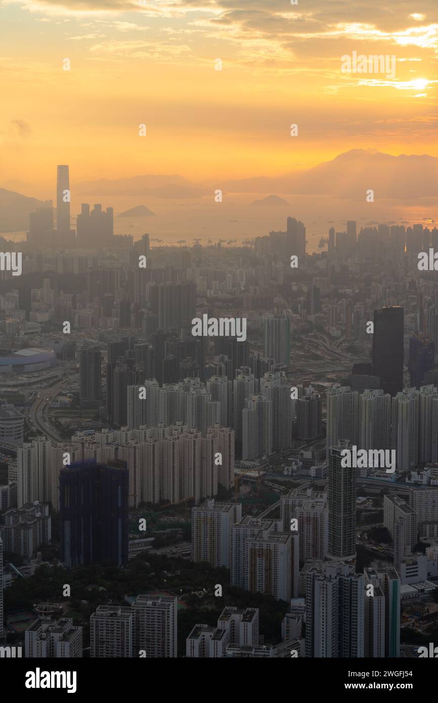 Sunset cityscape with towering buildings in the foreground Stock Photo ...