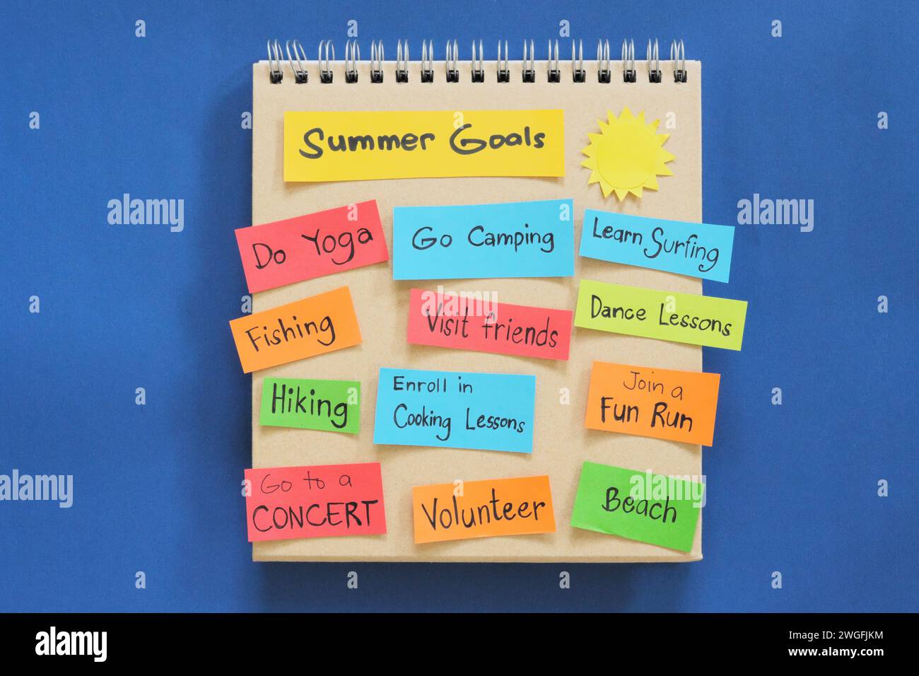 Summer goals concept. Checklist of goals in note pad in blue background ...