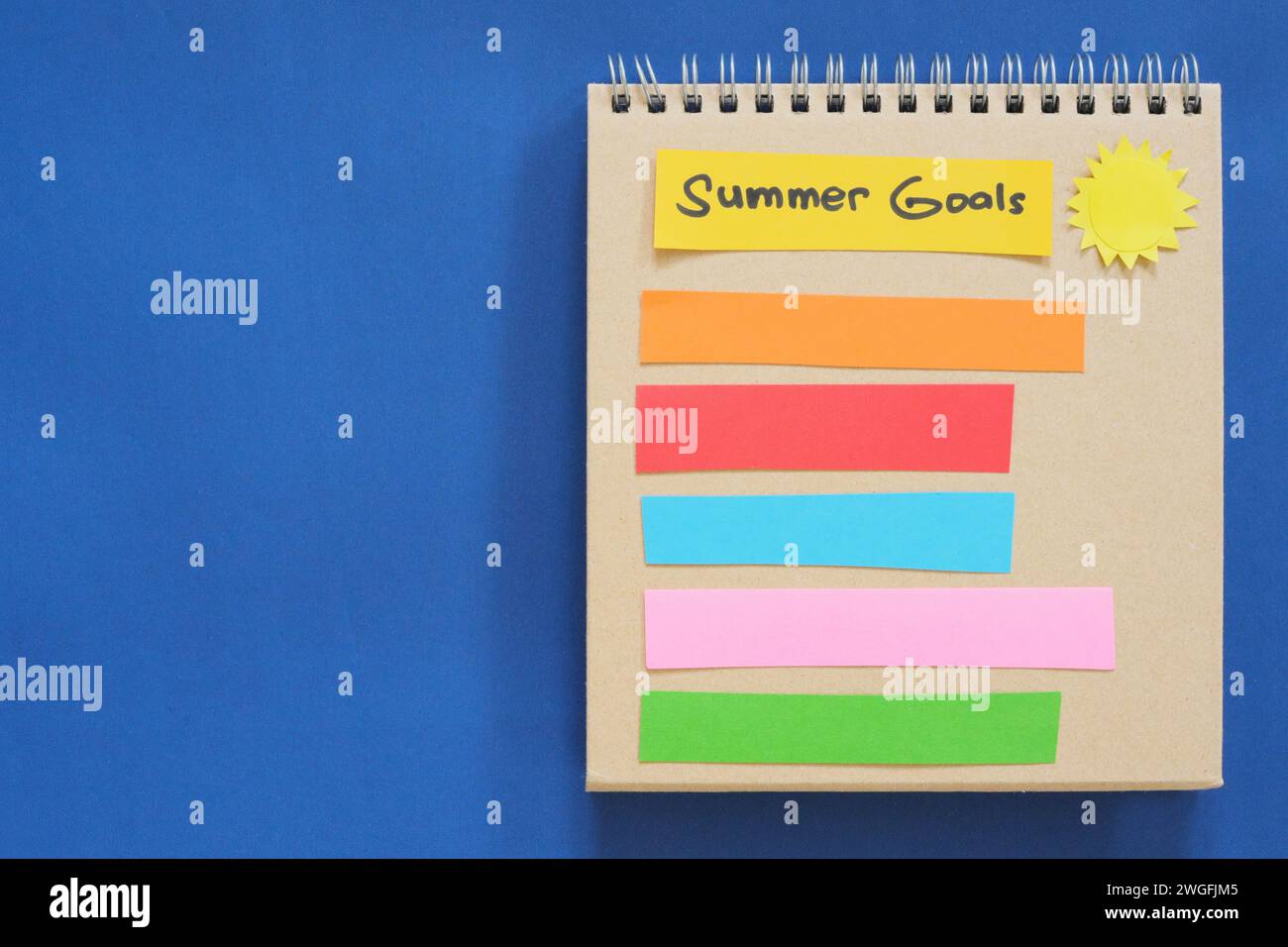 Summer goals concept. Checklist of goals in note pad in blue background ...