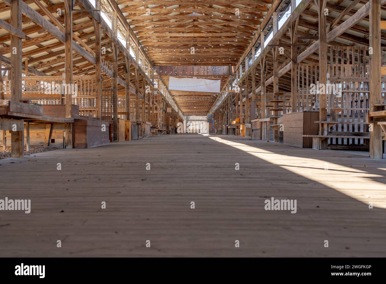 Empty open air farmers market wooden stalls within a pavilion on a ...