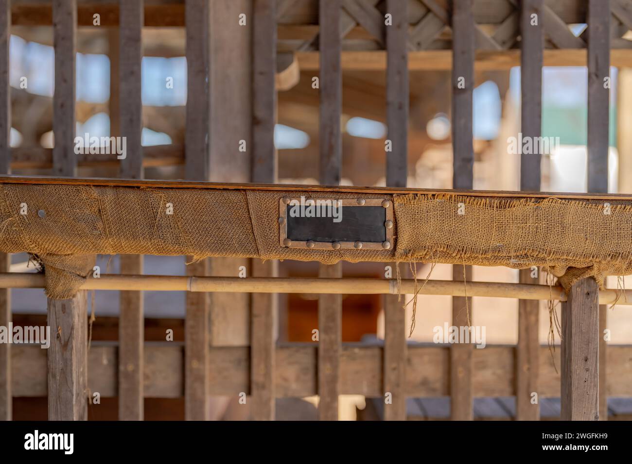 close up of a farmers market wooden stalls detail on a bright sunny day ...