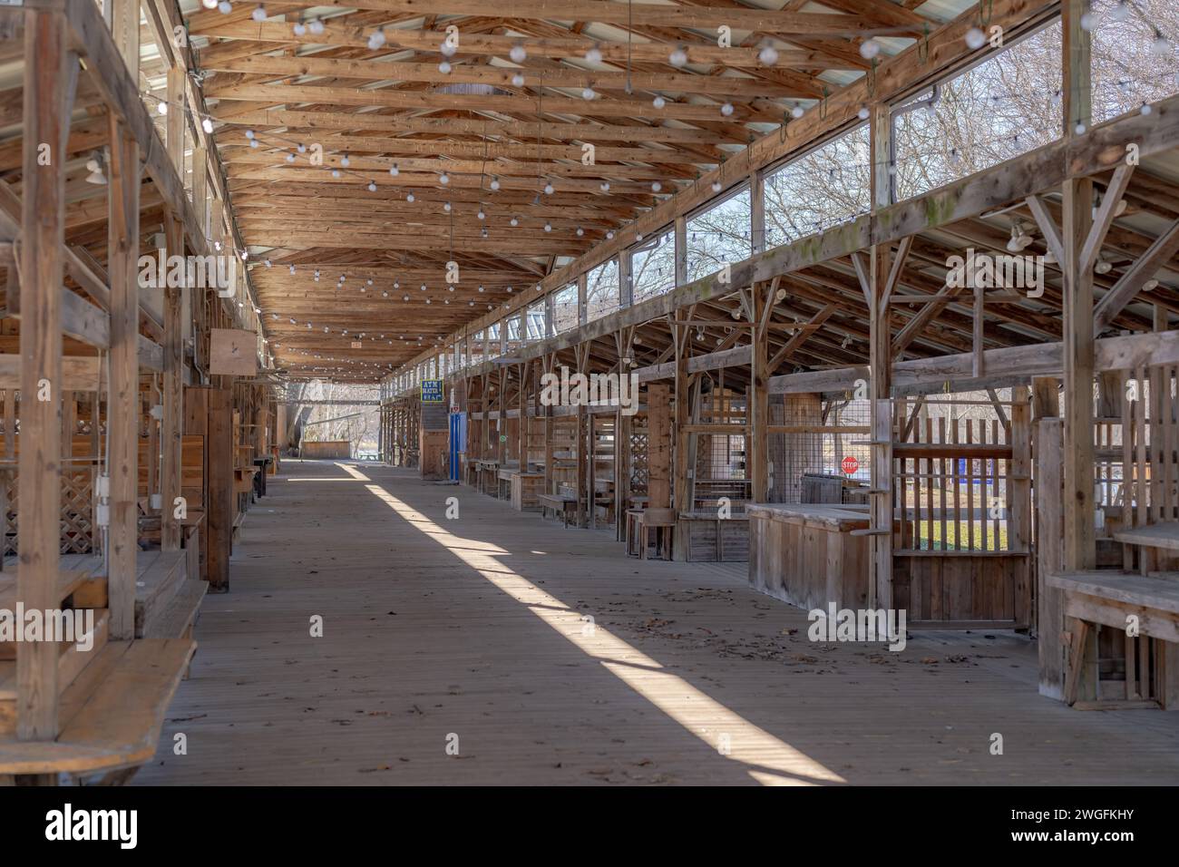 Empty open air farmers market wooden stalls within a pavilion on a ...