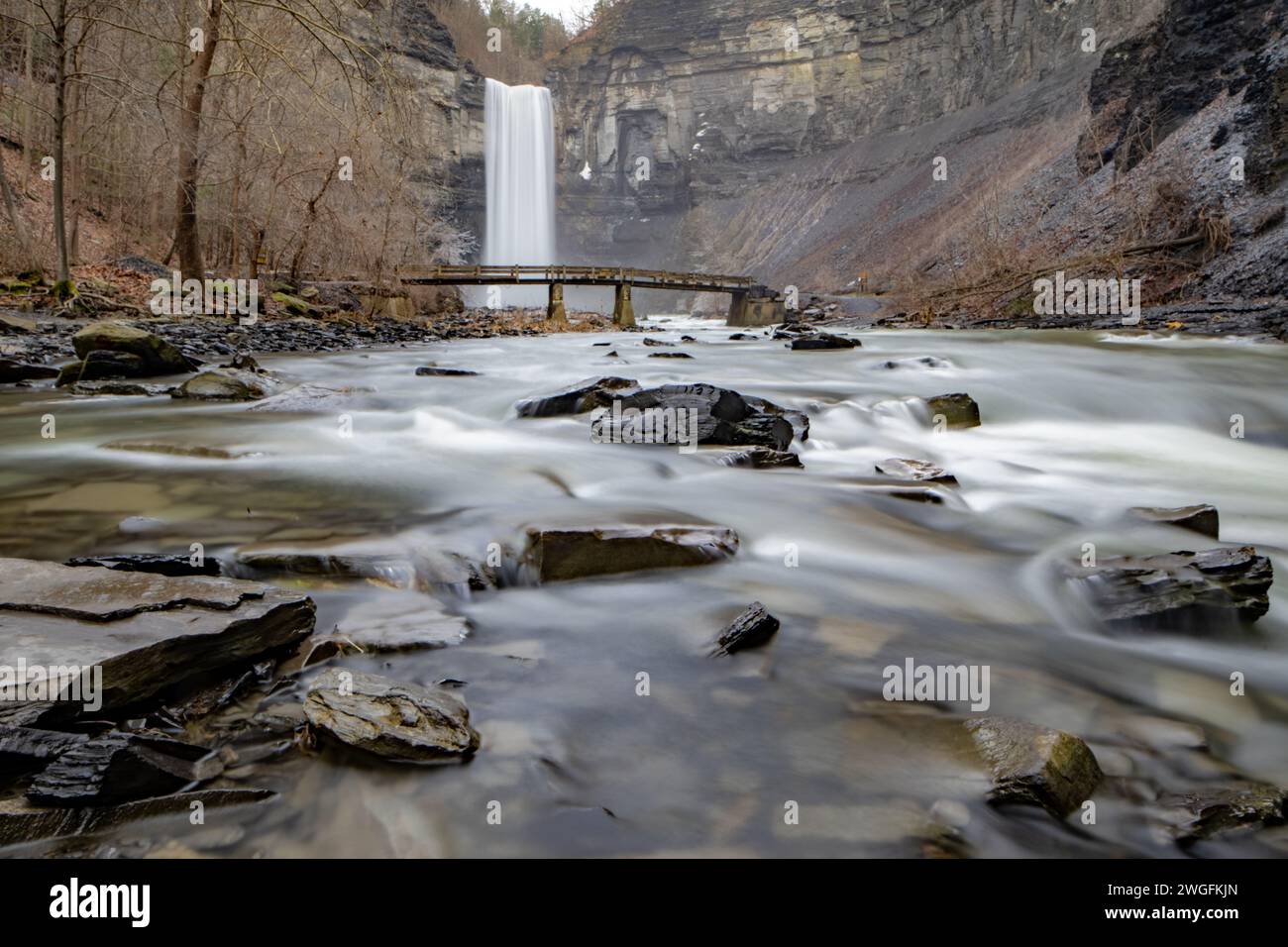 Long exposure winter photo of the Taughannock Falls and bridge at ...