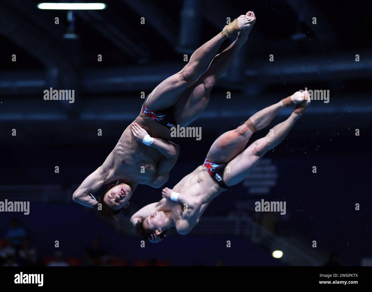 Doha, Qatar. 4th Feb, 2024. Wang Zongyuan/Long Daoyi (front) of China compete during the men's ...