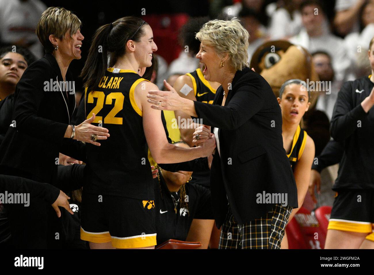 Iowa guard Caitlin Clark (22) and head coach Lisa Bluder react during ...