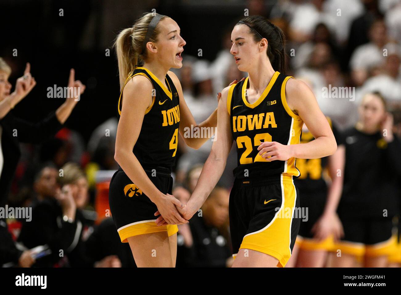 Iowa guard Caitlin Clark (22) and guard Kylie Feuerbach (4) in action ...