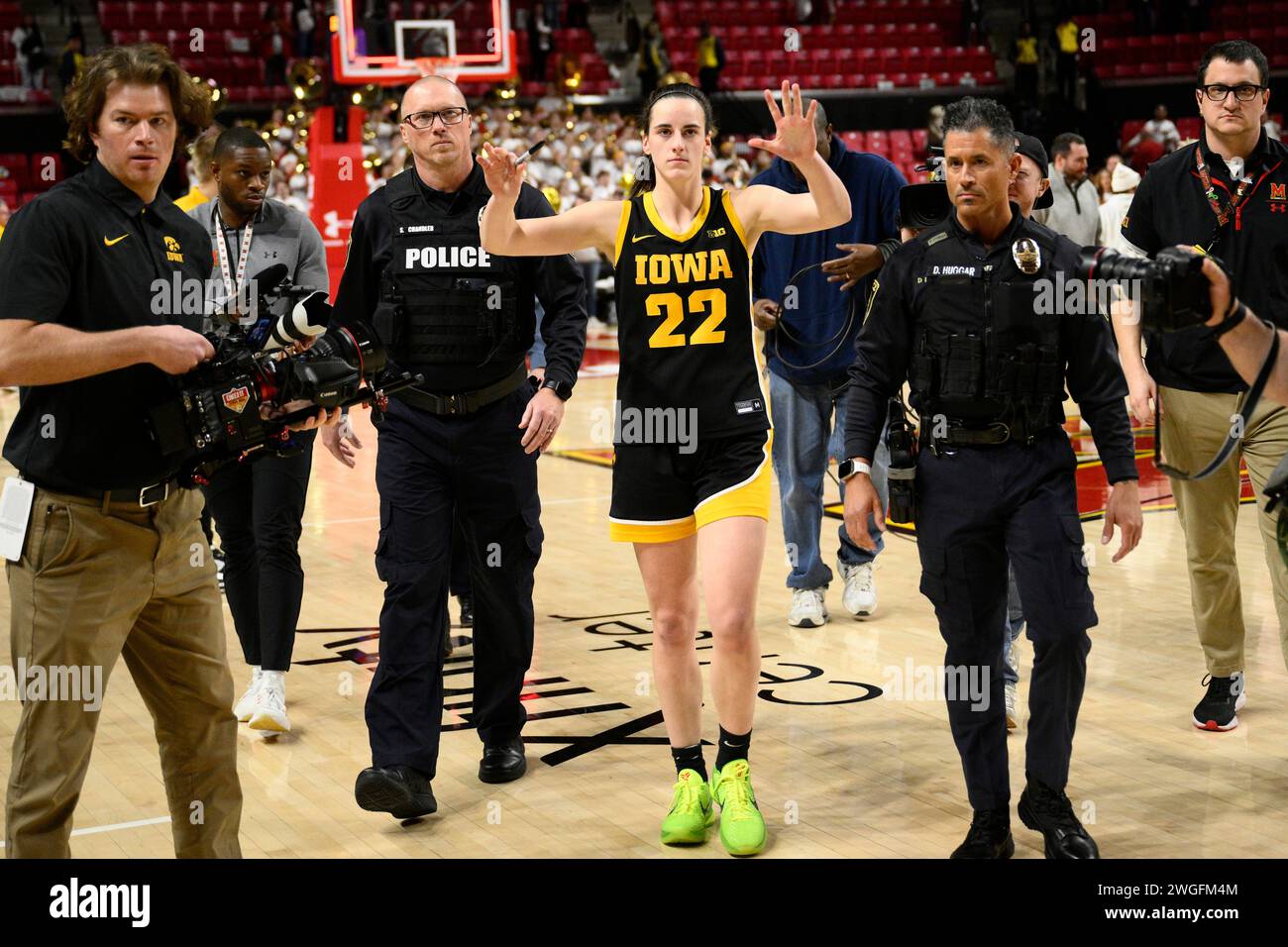 Iowa guard Caitlin Clark (22) walks off the court after an NCAA college ...