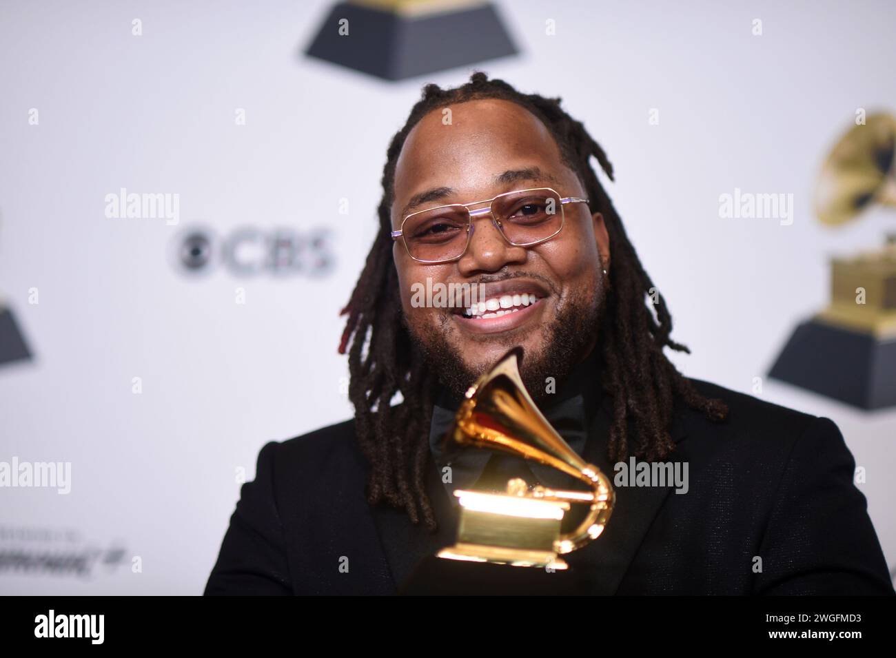 Leon Thomas poses in the press room with the award for best R&B song ...