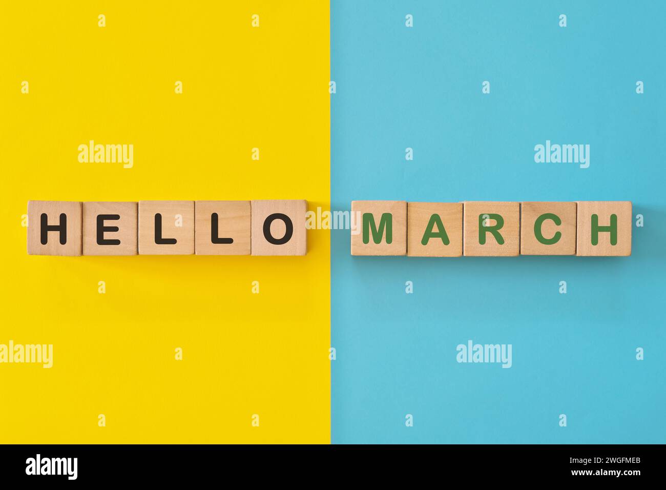 Hello month of March concept. Wooden blocks typography in bright blue ...