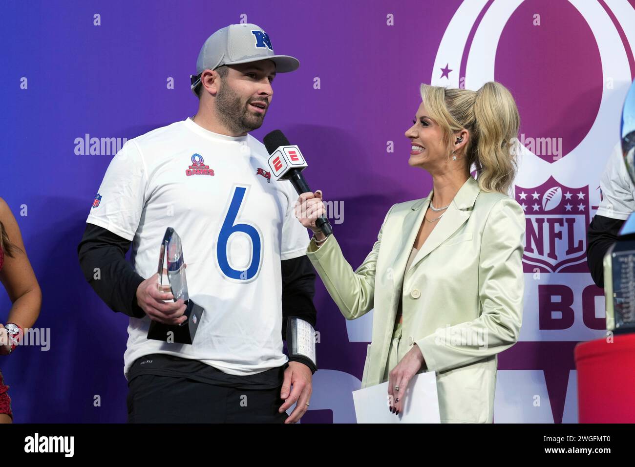 Tampa Bay Buccaneers quarterback Baker Mayfield is presented with the ...