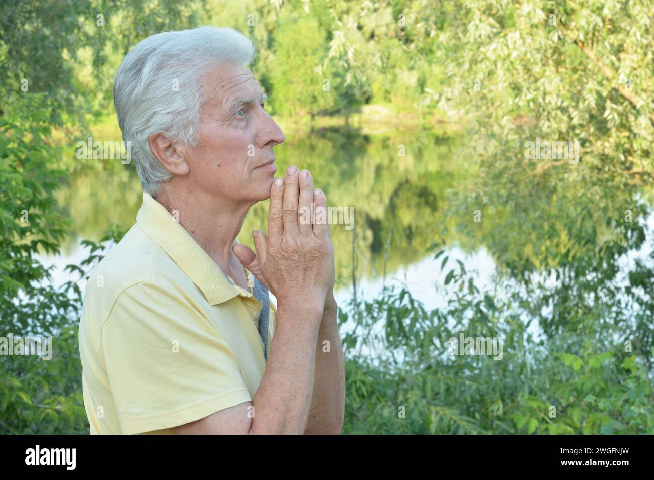 Middle age man praying hands hi-res stock photography and images - Alamy