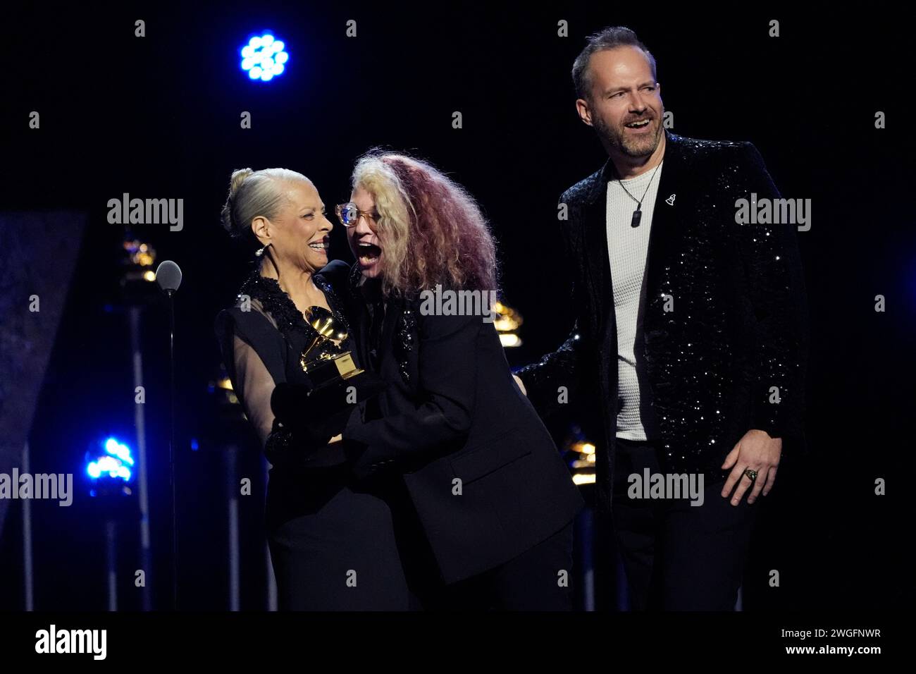 Patti Austin, from left, presents Janet Robin, and Markus Illko the ...