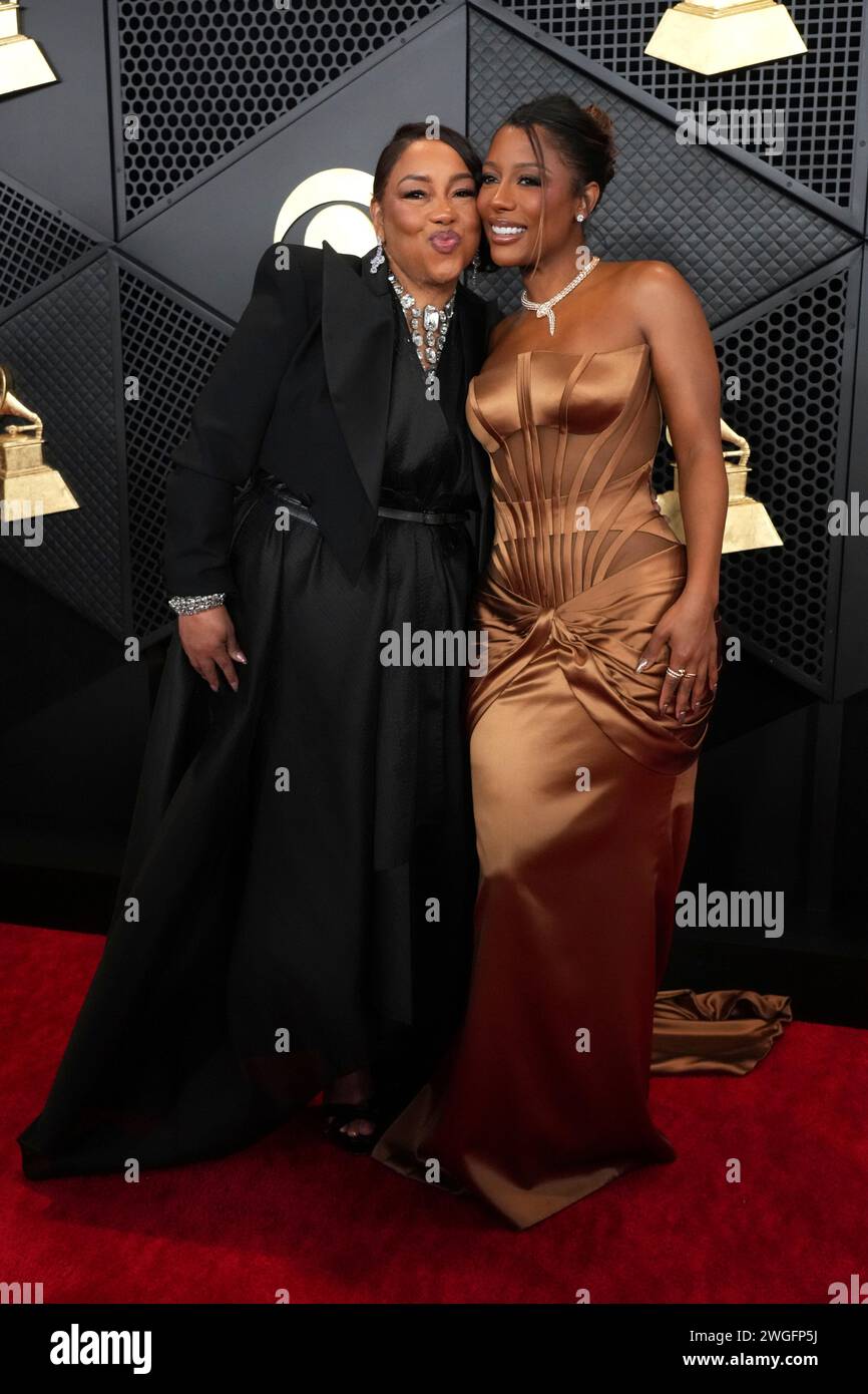 L'Tanya Chestang-Cubit, left, and Victoria Monet arrive at the 66th ...