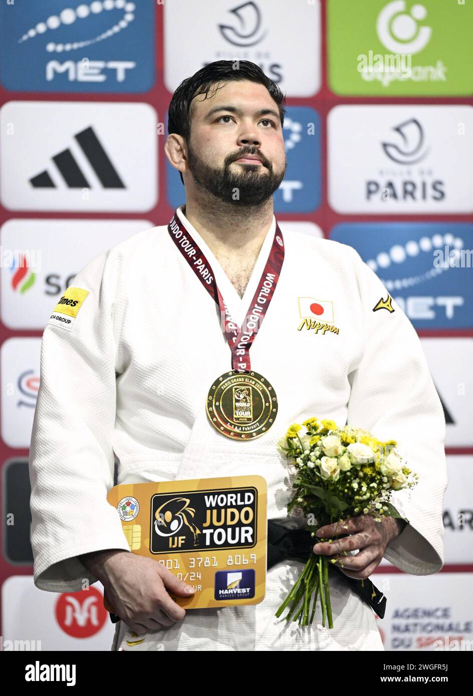 Aaron Wolf of Japan is pictured with his gold medal around his neck ...