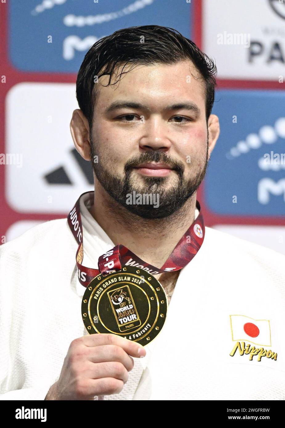 Aaron Wolf of Japan poses for a photo after winning the gold medal in ...
