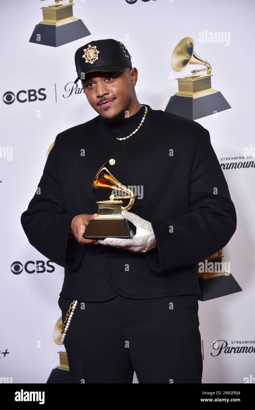 Khris Riddick-Tynes poses in the press room with the award for best R&B ...