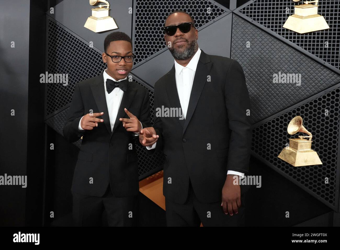 Riley Glasper, left, and Robert Glasper arrive at the 66th annual ...