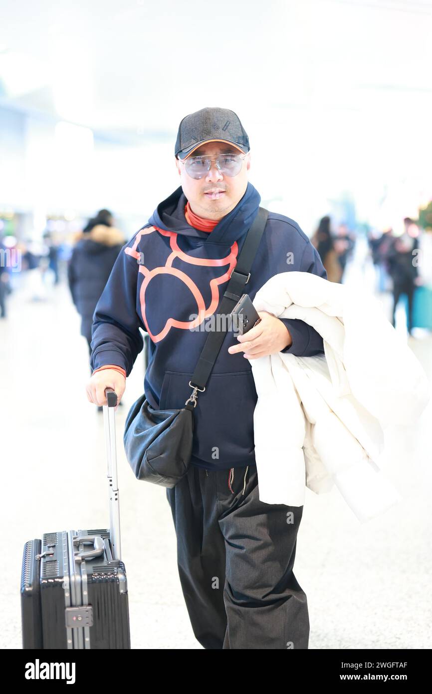 Chinese actor and director Xu Zheng appears at the airport in Shanghai ...