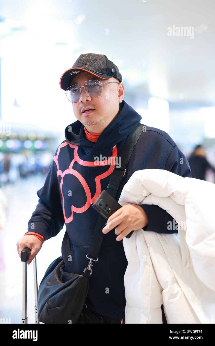 Chinese actor and director Xu Zheng appears at the airport in Shanghai ...