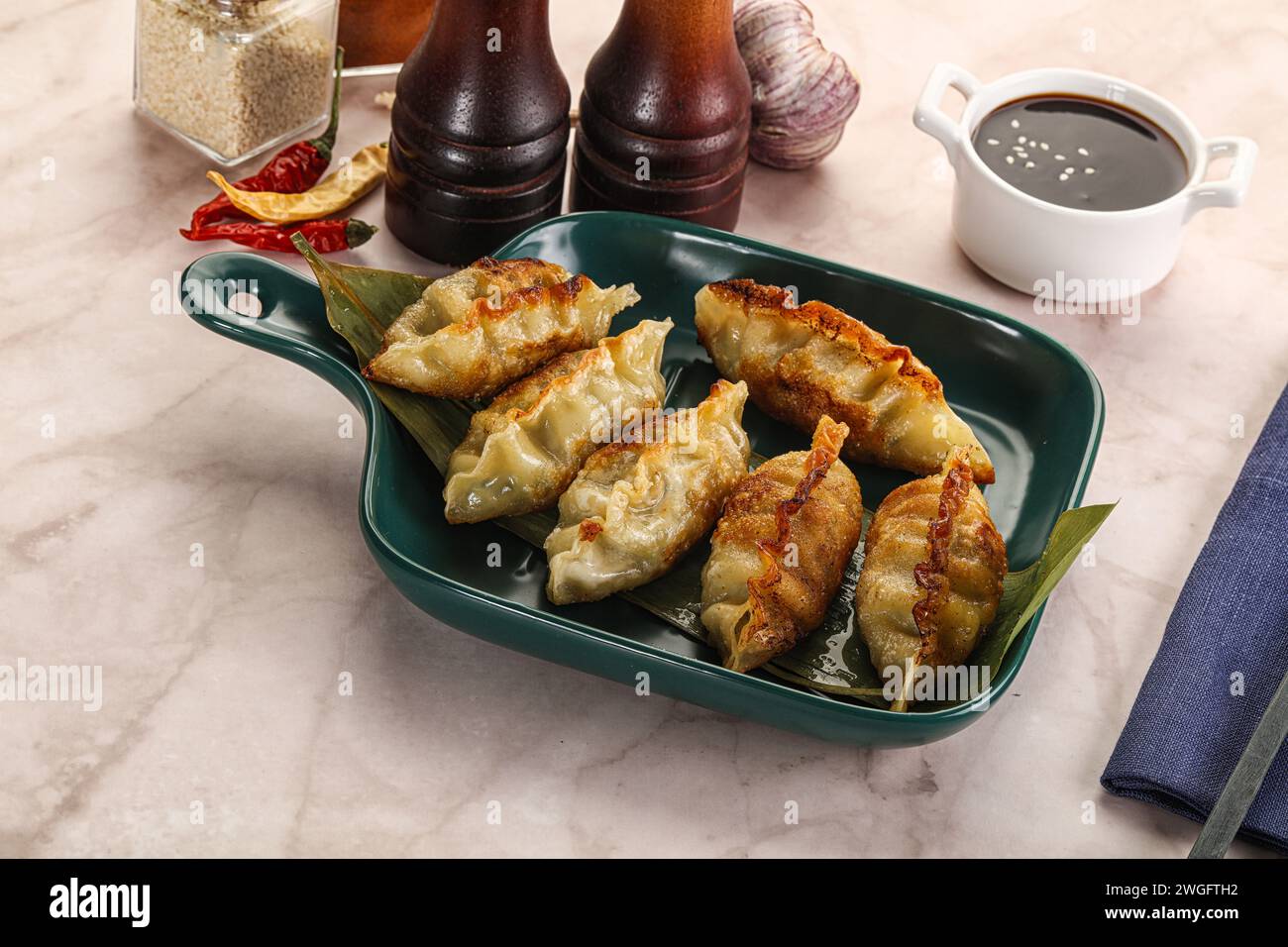 Fried Japanese stuffed dumplings - Gyoza with meat Stock Photo - Alamy