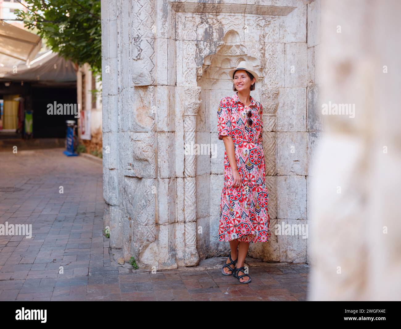 female summer travel to Antalya, Turkey. young asian woman in red dress ...