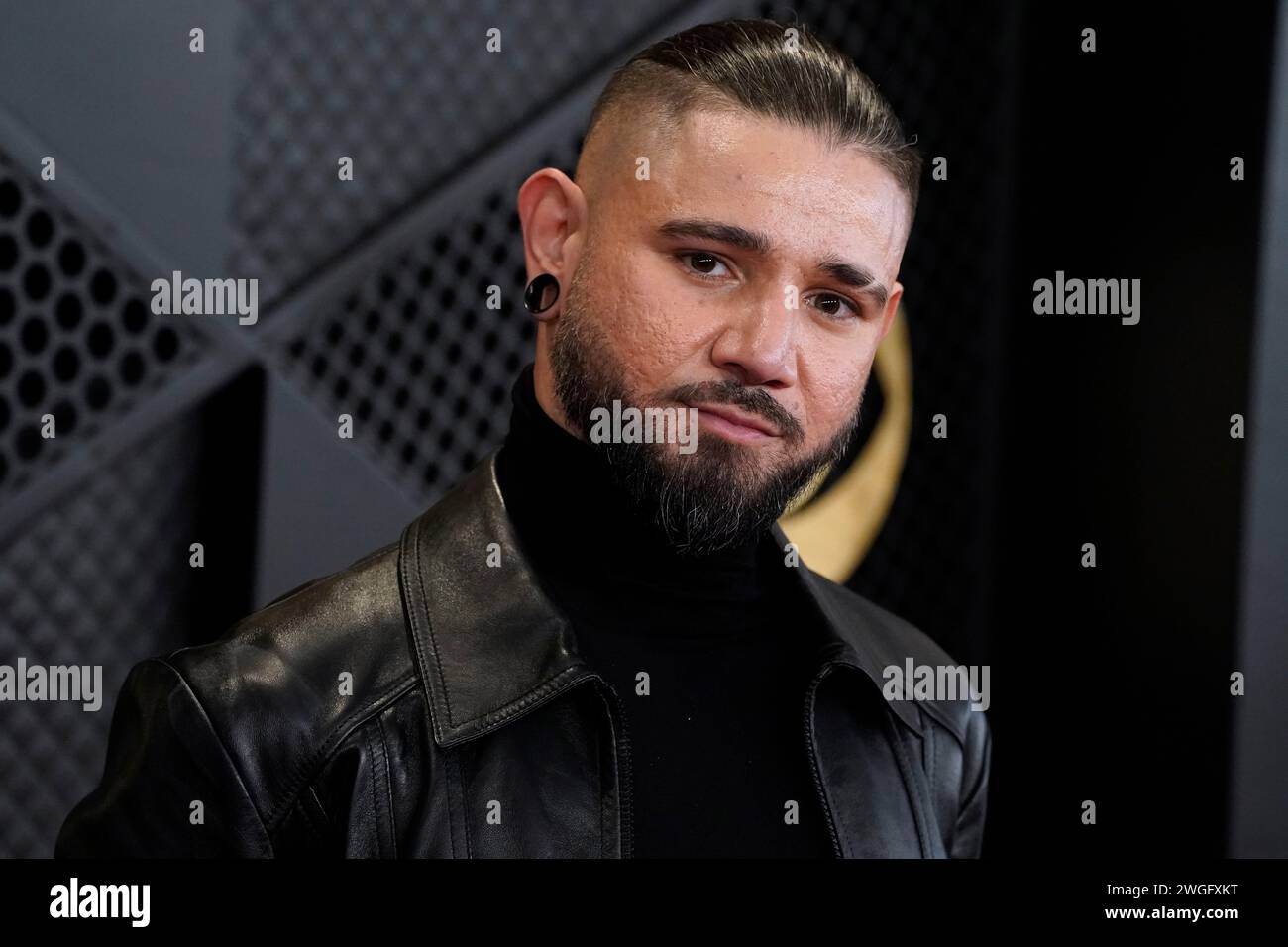 Skrillex arrives at the 66th annual Grammy Awards on Sunday, Feb. 4 ...