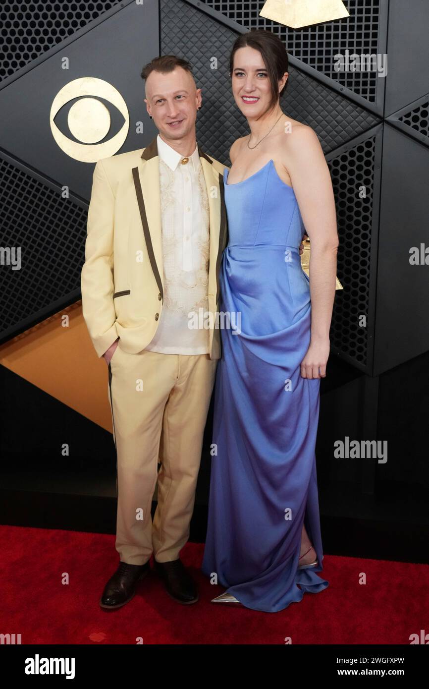 Chris Kasych, left, and Laura Sisk arrive at the 66th annual Grammy ...
