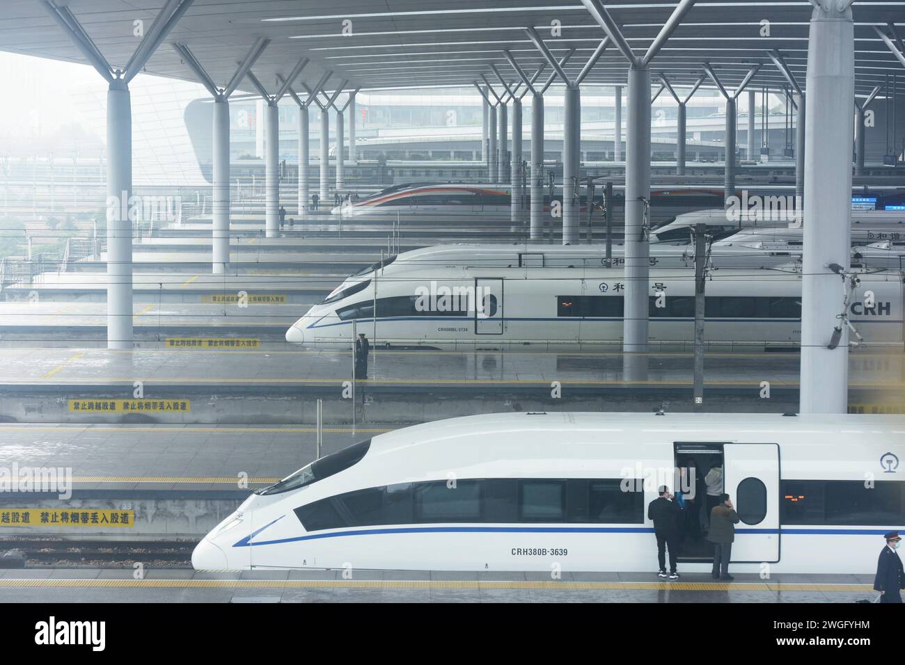 Passengers wait for their trains at Hangzhoudong railway station in ...