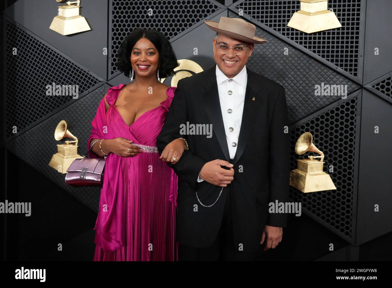 Vania Kinard, left, and Dom Flemons arrive at the 66th annual Grammy ...