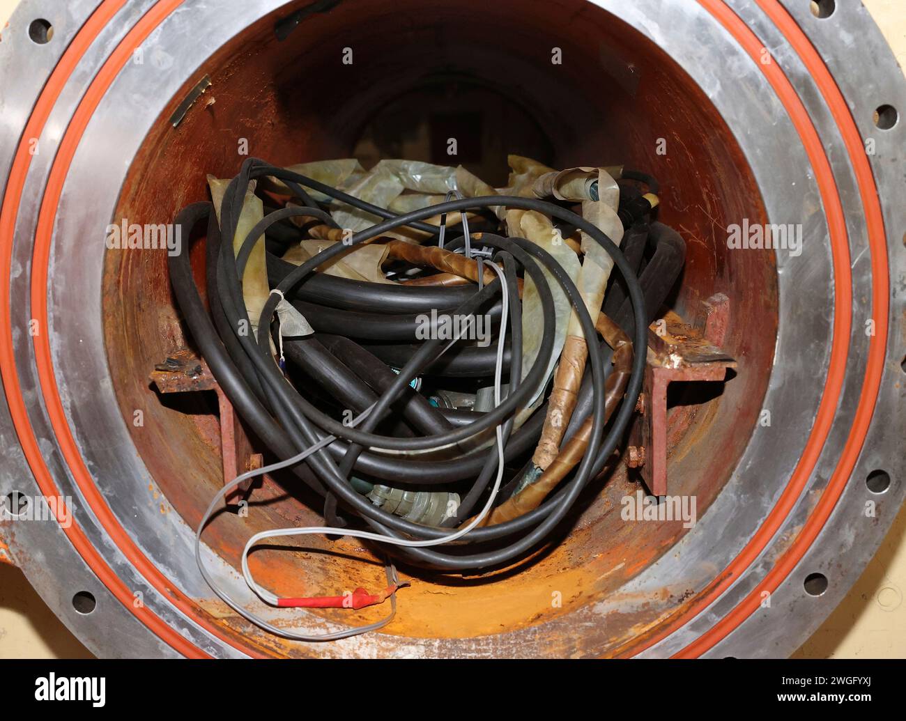 A photo shows Unit 5 penetration hole X-6 leading to the reactor ...
