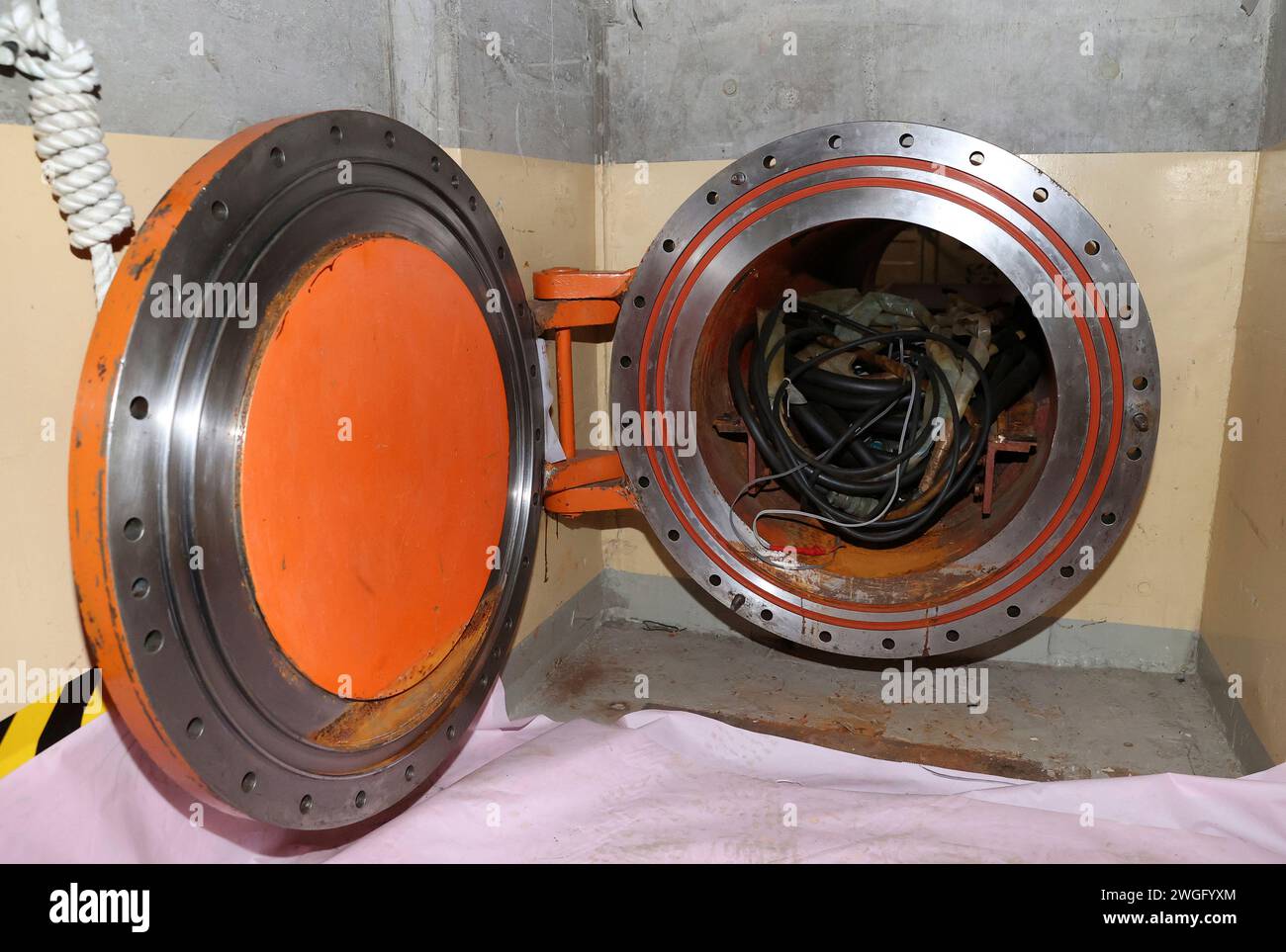 A photo shows Unit 5 penetration hole X-6 leading to the reactor ...