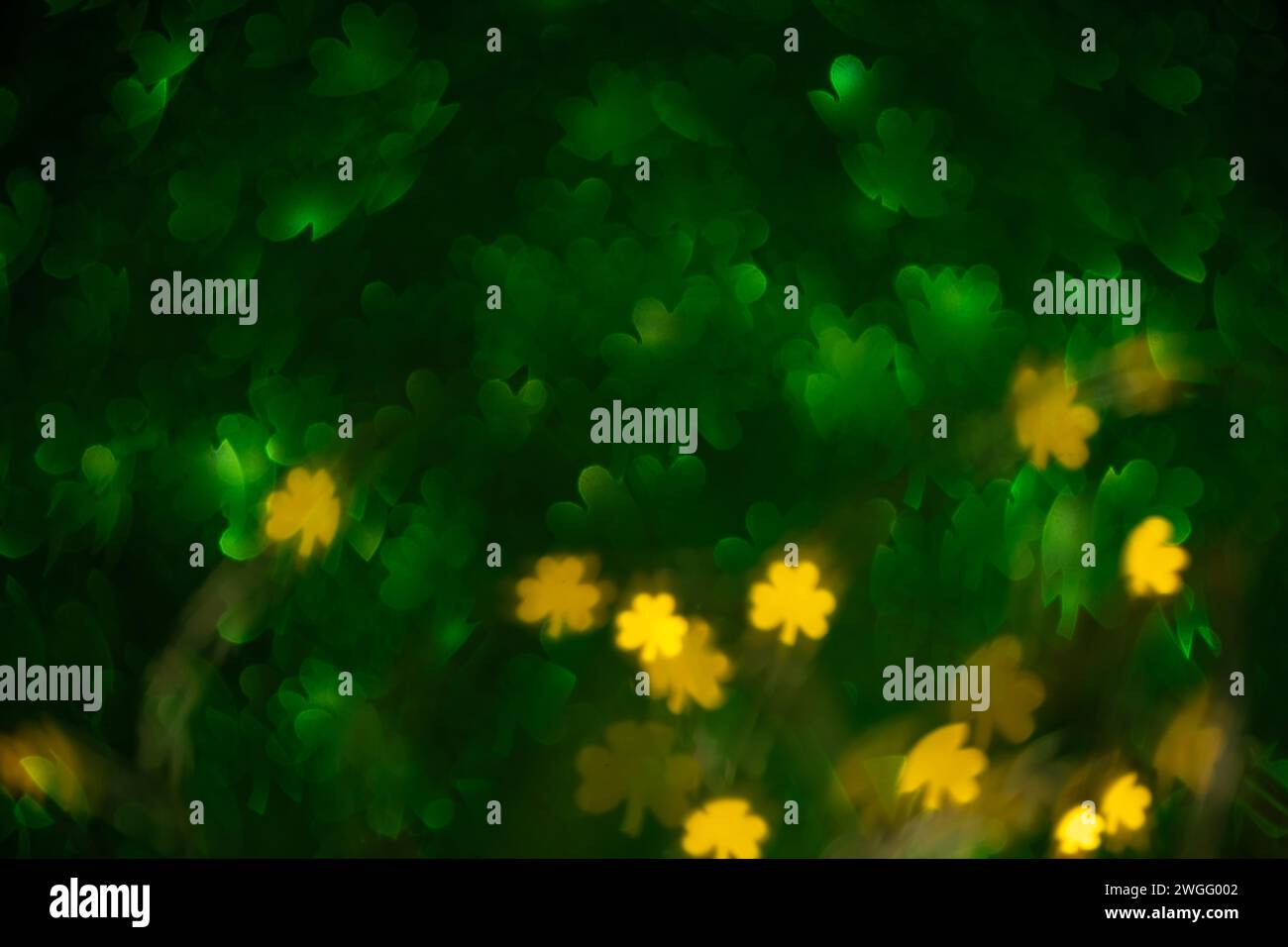 Abstract green background with clover leaves highlights. Spring, summer ...