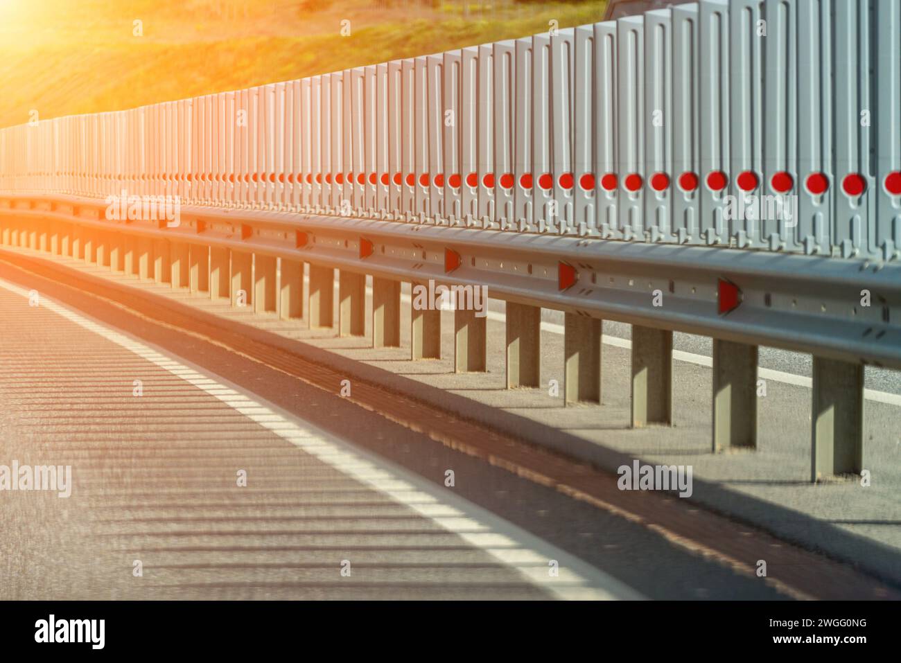 Safety barriers on highway. Anodized safety steel barrier. Enhancing ...