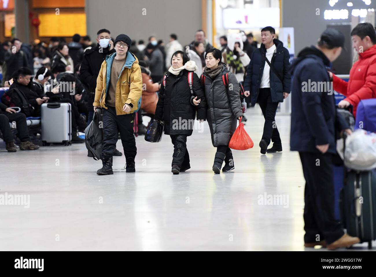 Passengers wait for their trains at Changchun railway station in ...