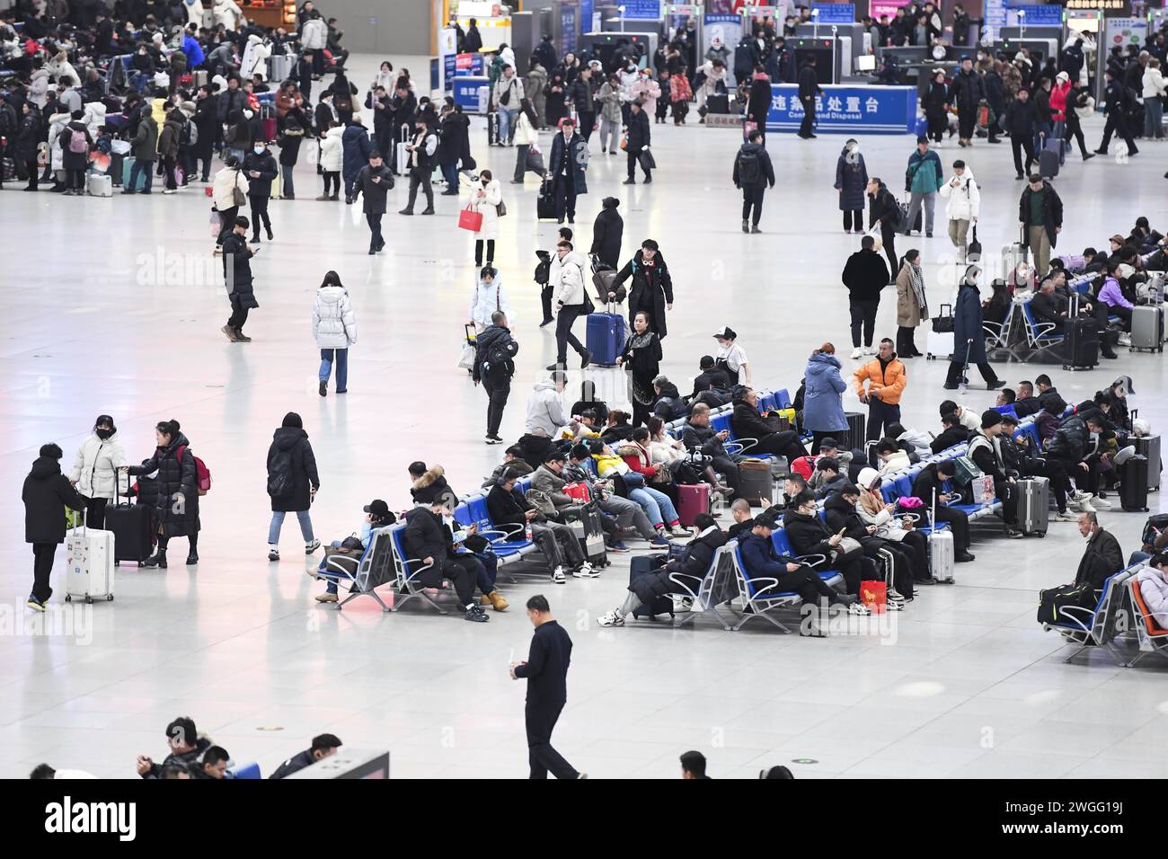 Passengers wait for their trains at Changchun railway station in ...