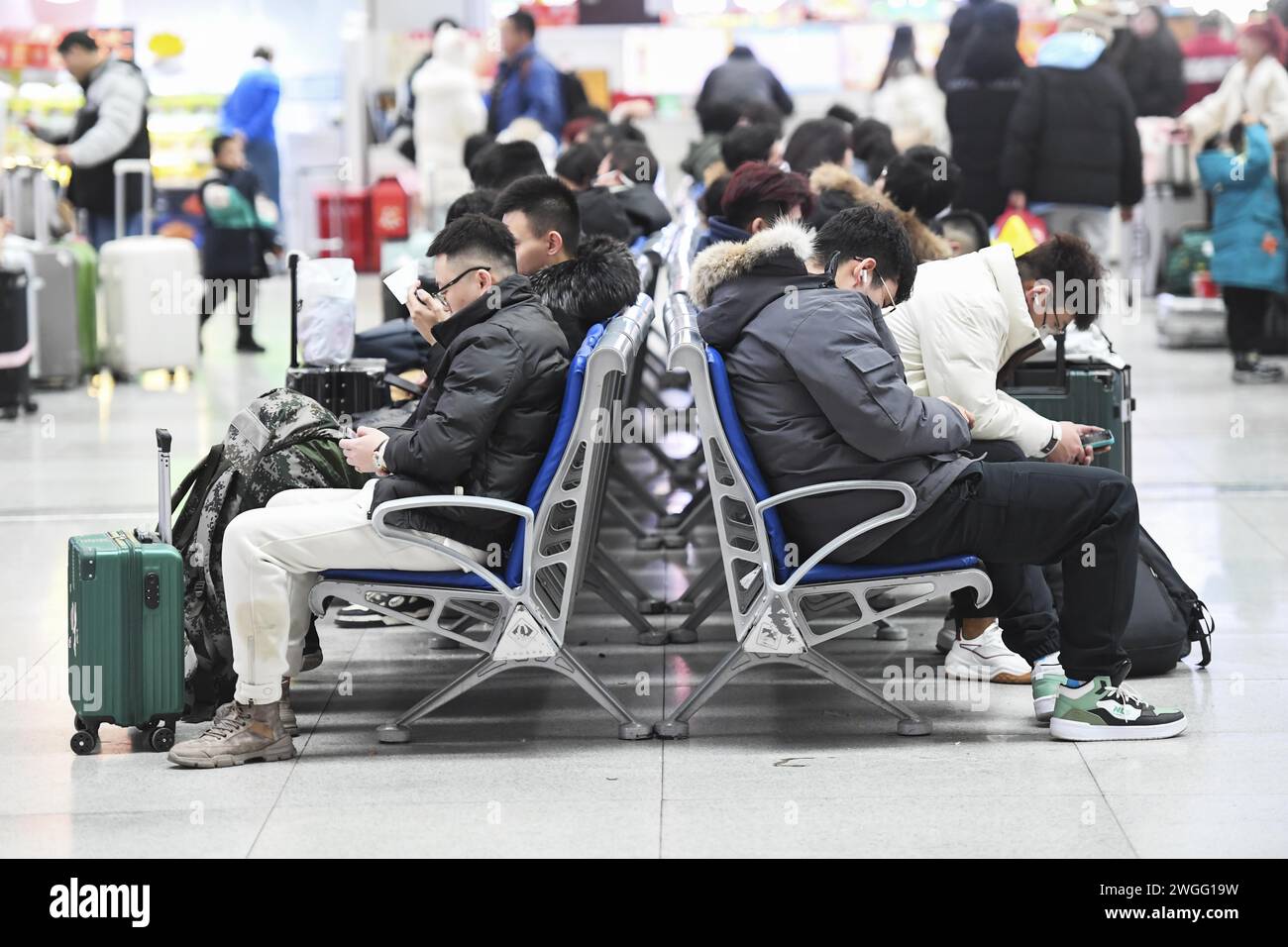 Passengers wait for their trains at Changchun railway station in ...