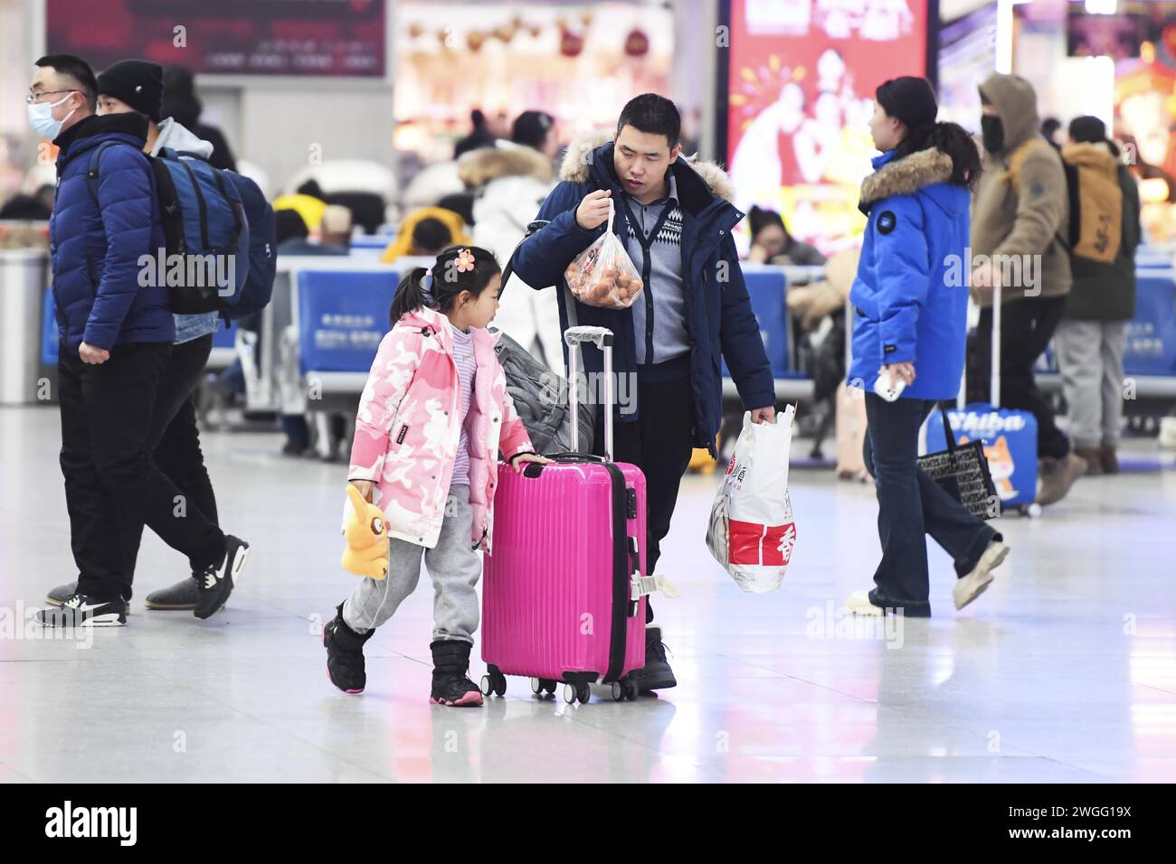 Passengers wait for their trains at Changchun railway station in ...