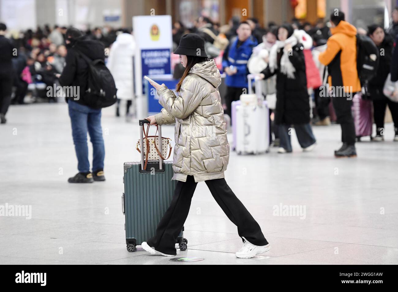 Passengers wait for their trains at Changchun railway station in ...