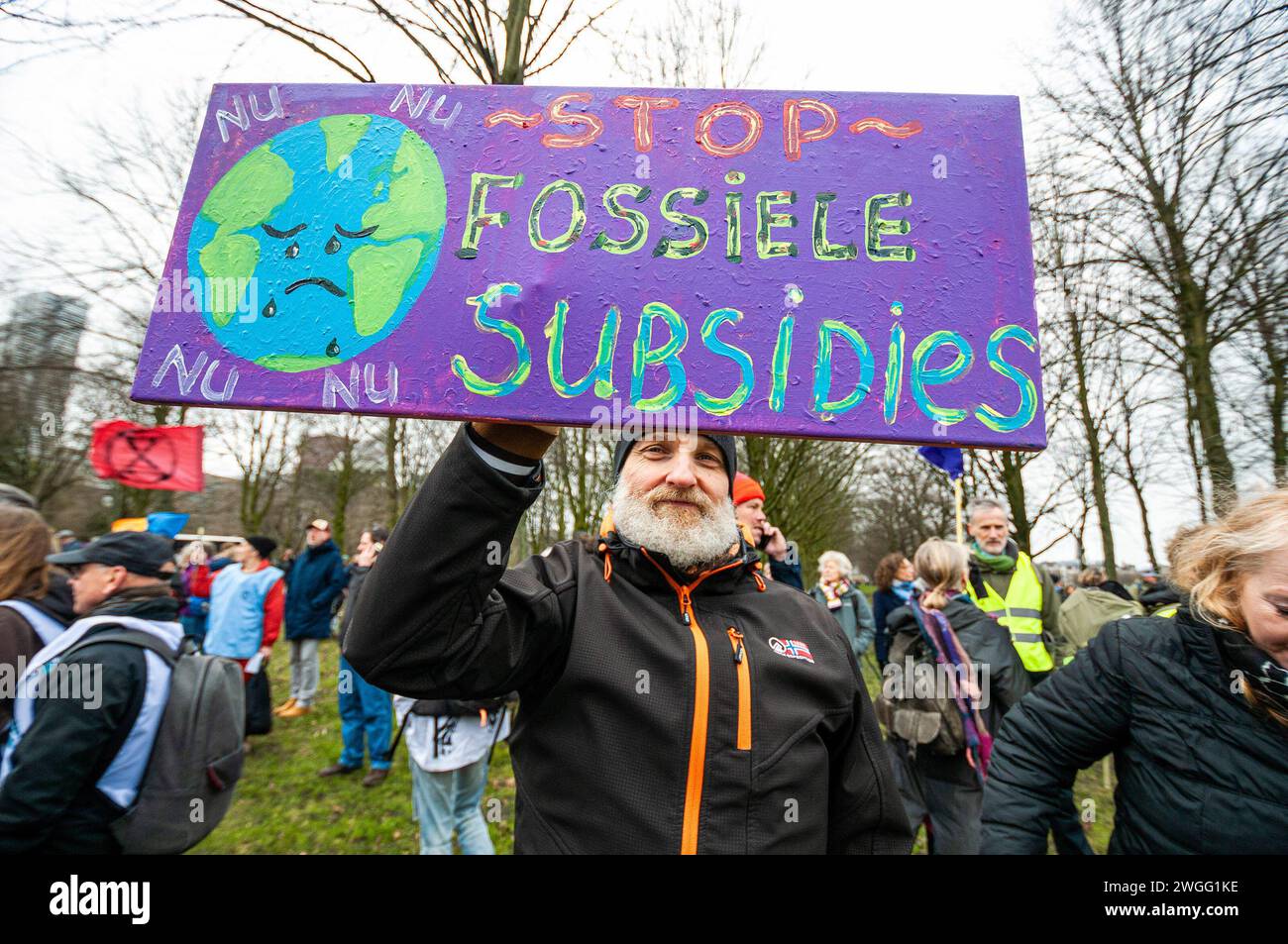 Extinction Rebellion activist holds a placard expressing his opinion ...