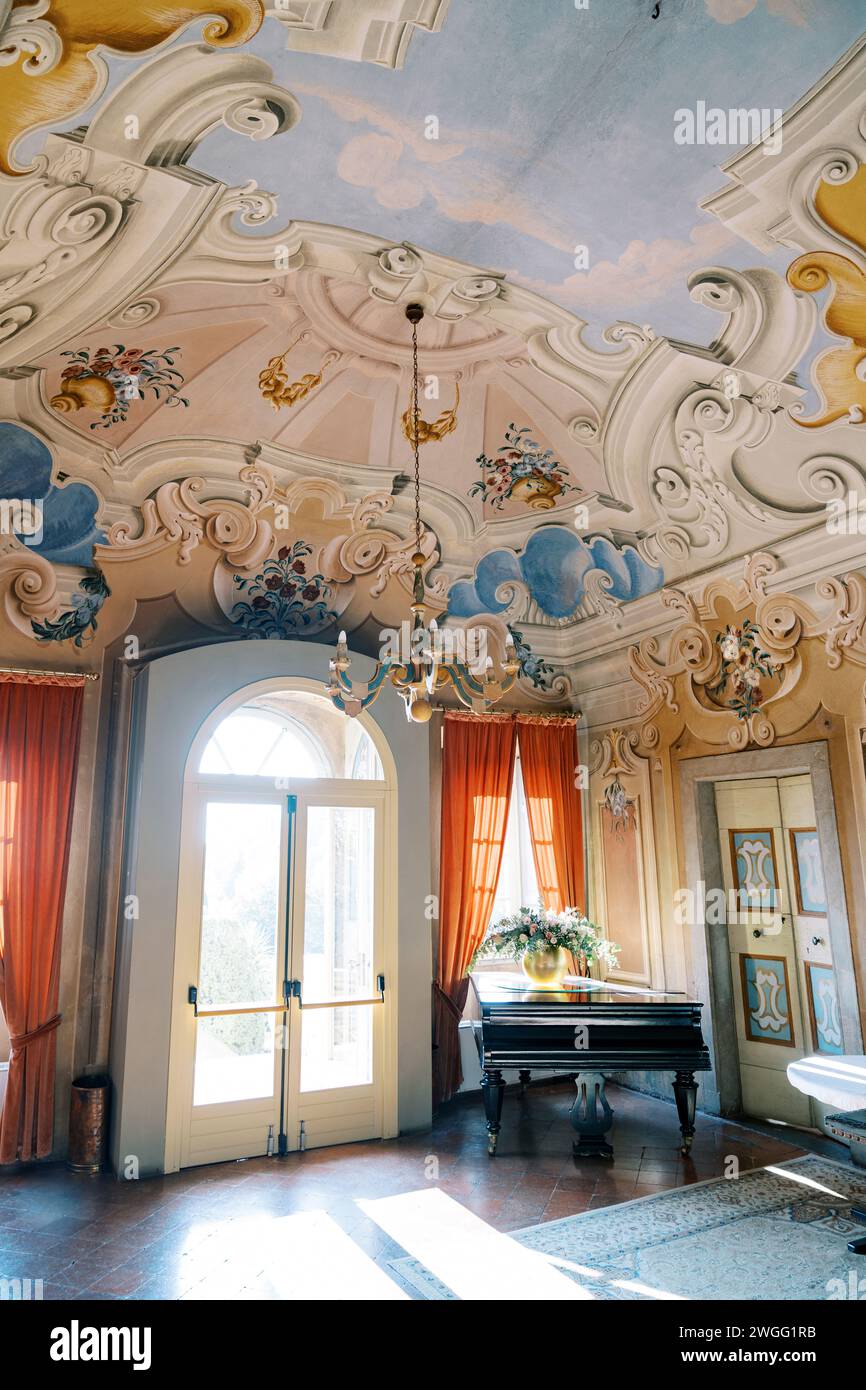 Colorful painted ceiling with stucco and chandelier of a luxurious ...