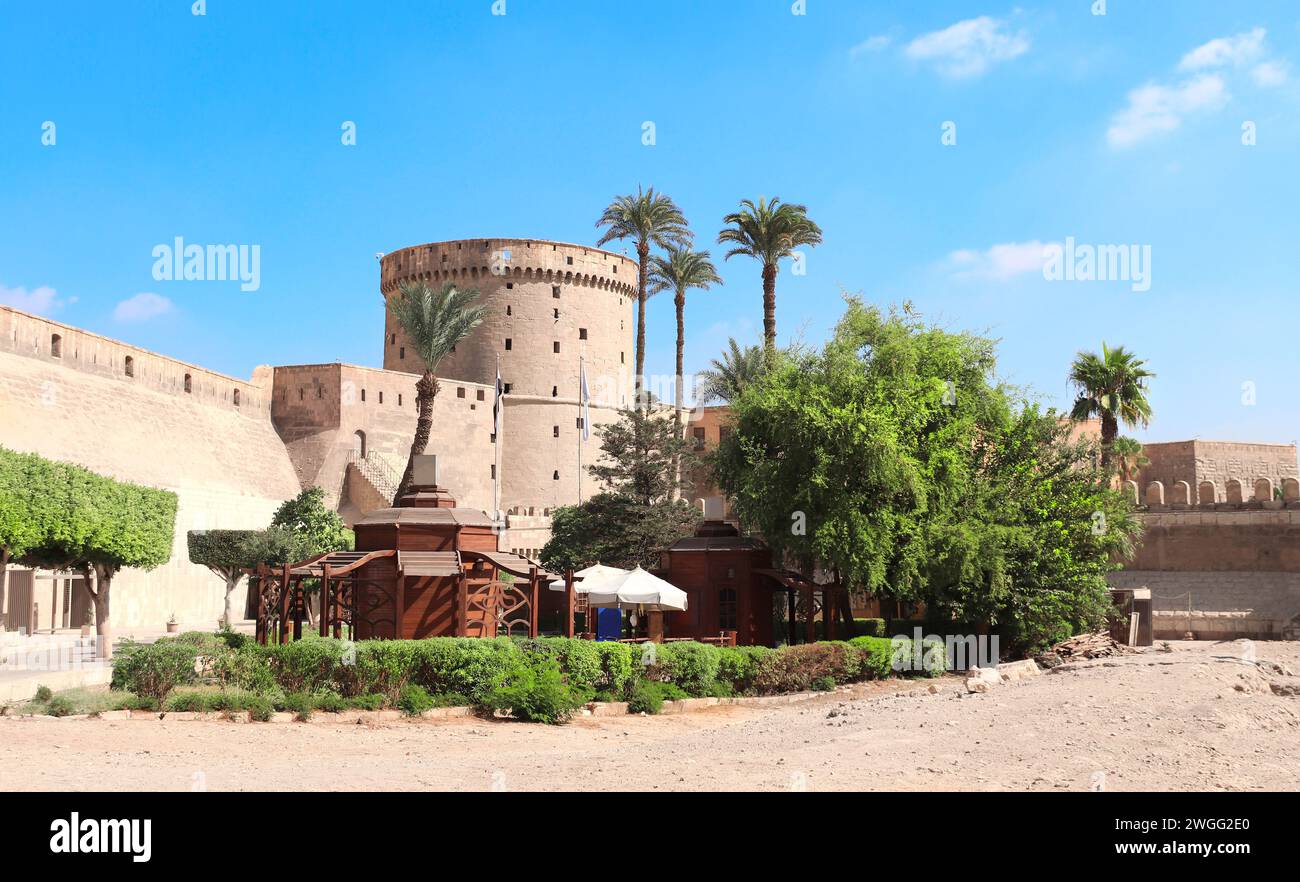 Watch tower, fortress wall and palm trees in ancient Cairo Citadel ...