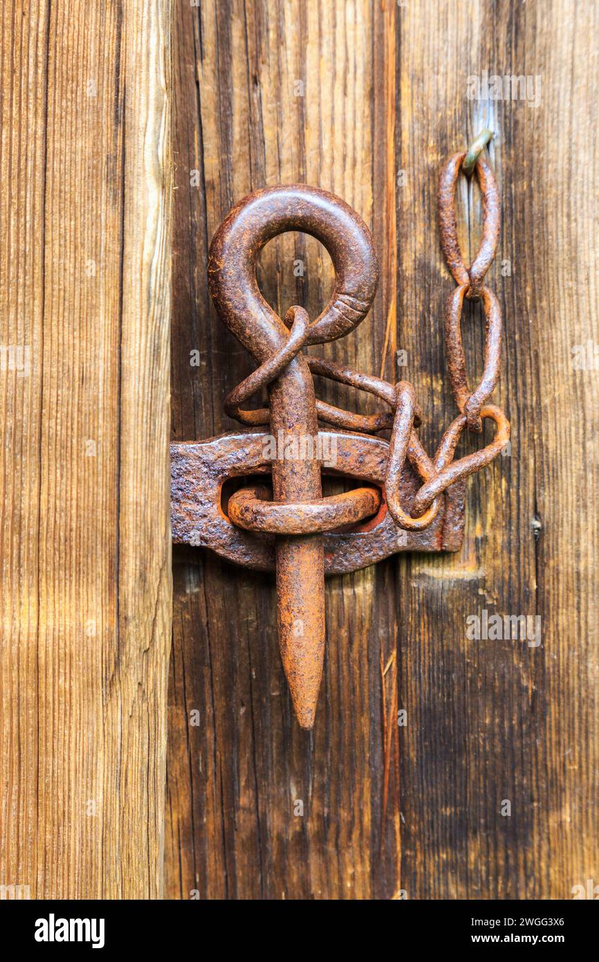 Old iron lock on a wooden door Stock Photo - Alamy