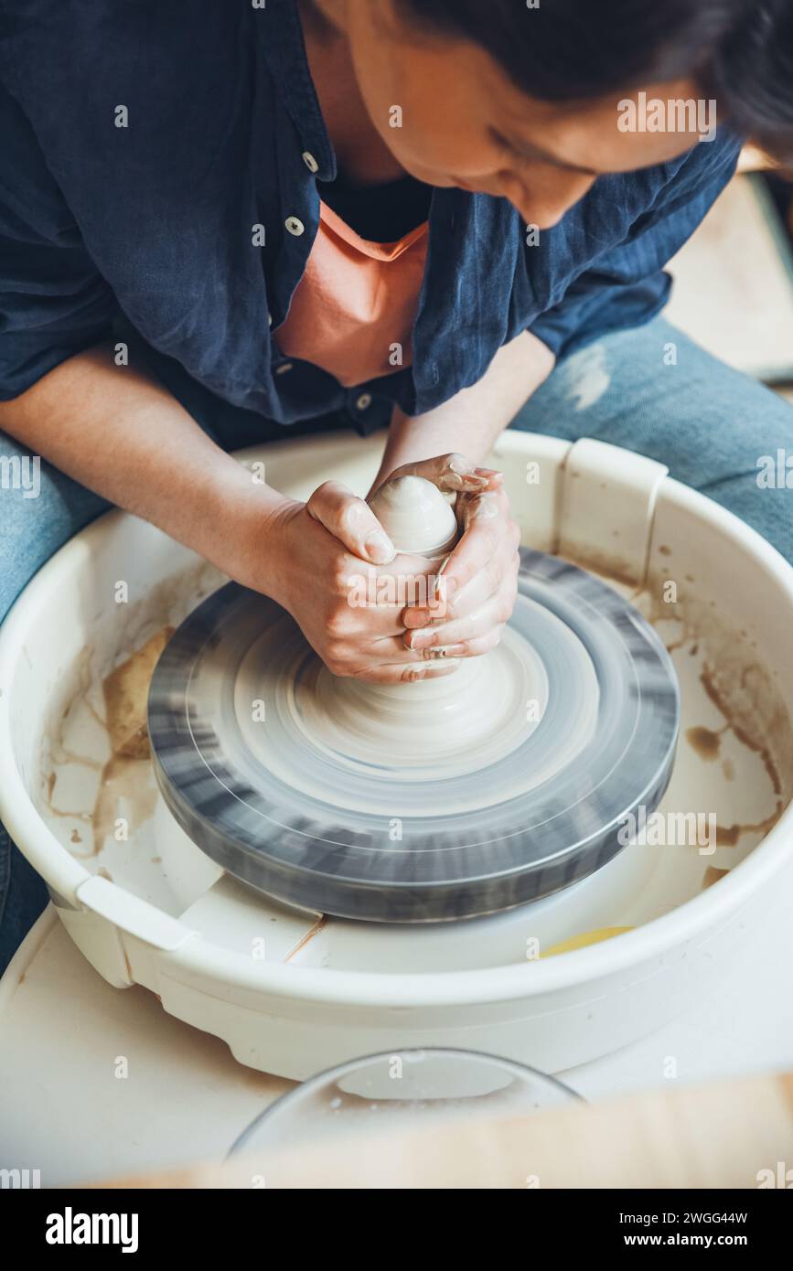 Pottery skill, woman ceramist works on potter's wheel Stock Photo - Alamy