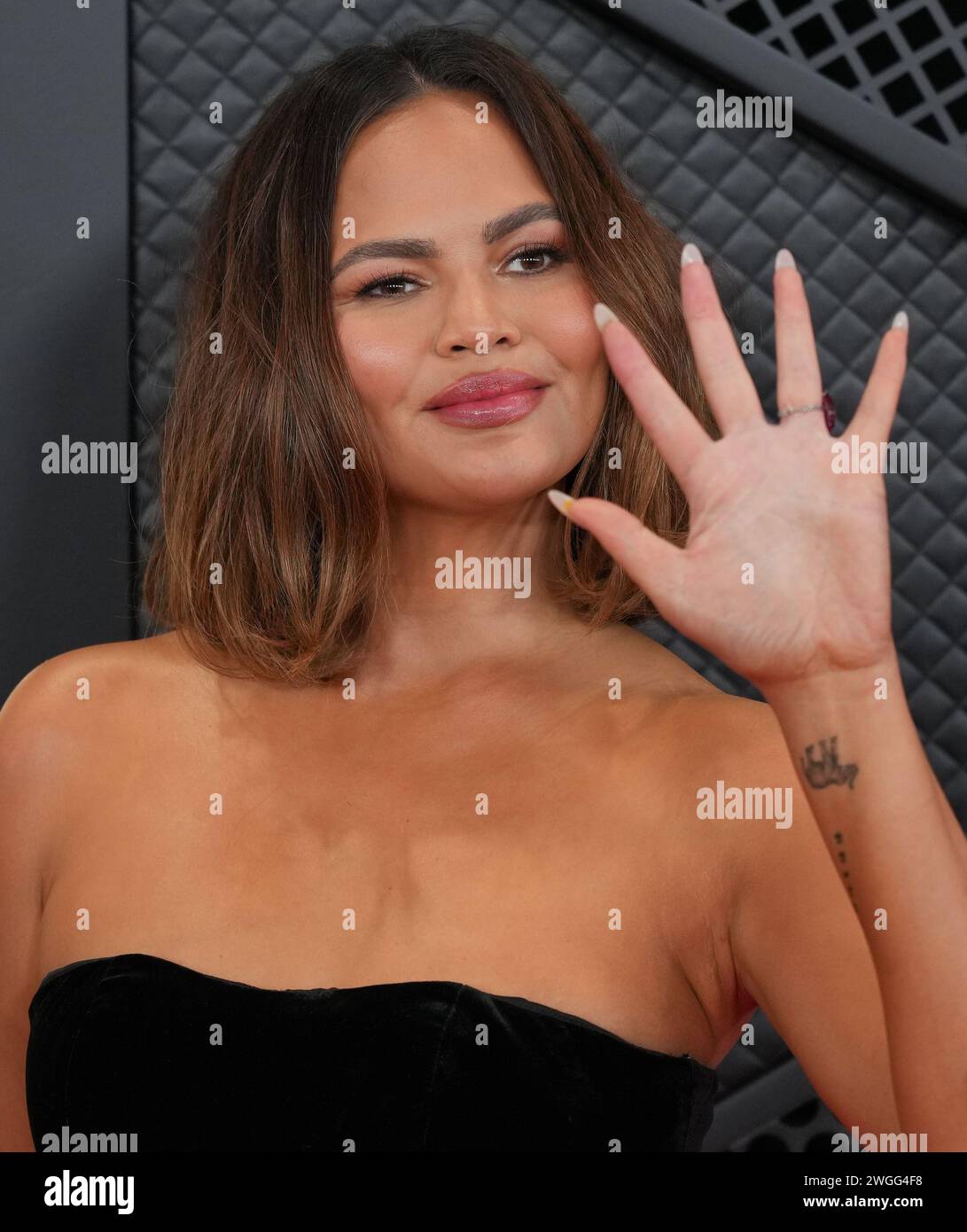 Chrissy Teigen arrives at the 66th Annual Grammy Awards held at the ...